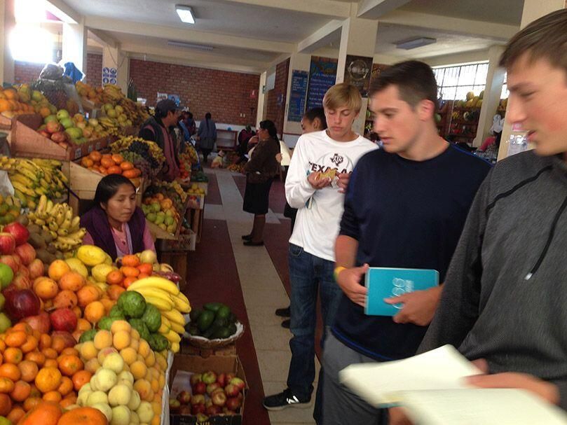 Students visit the local market during class.. (Level 1).